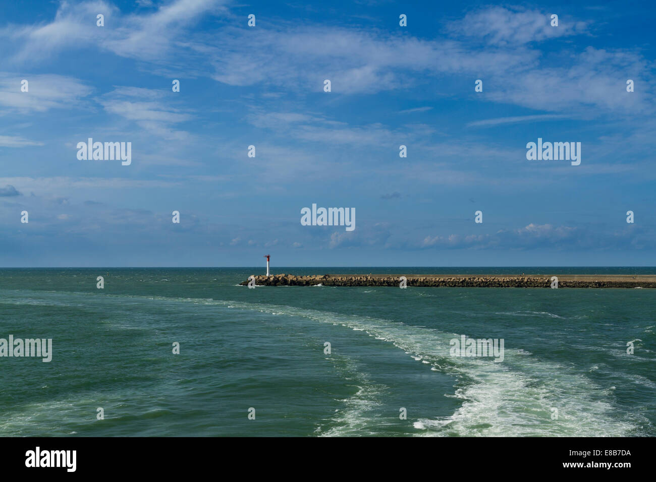 With wash from ferry, entrance to Dunkirk Harbor, France, Europe Stock ...