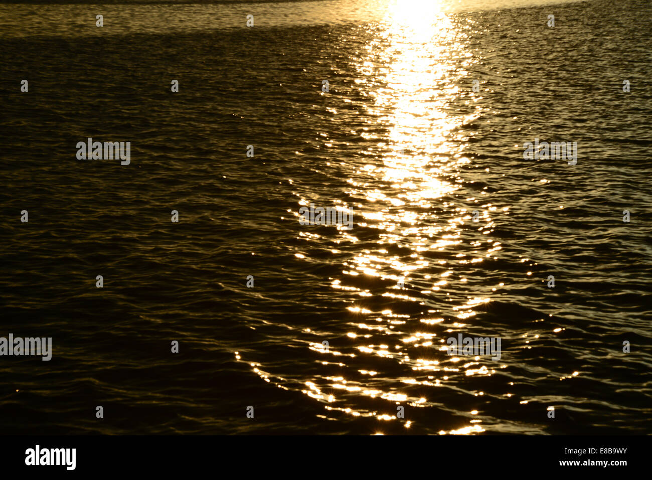 Sunlight reflection on the water Stock Photo - Alamy