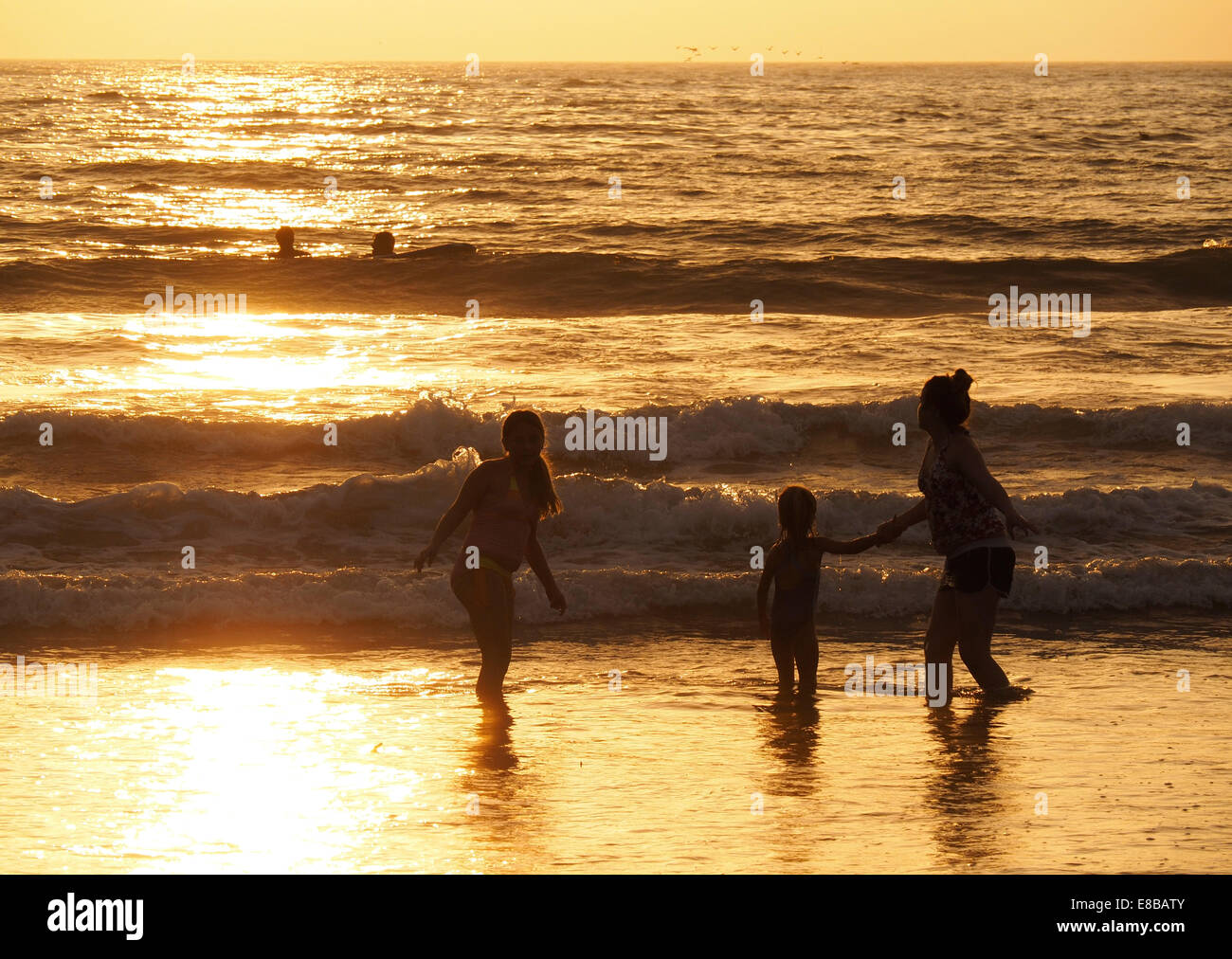 Children playing in the sea hi-res stock photography and images - Alamy