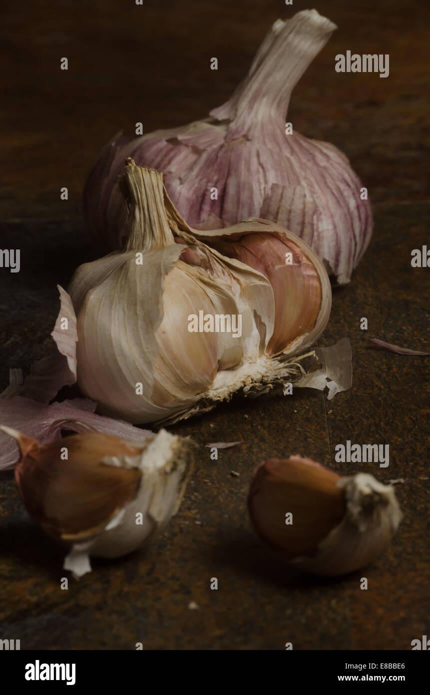 detail of garlics over a stone textured table Stock Photo - Alamy