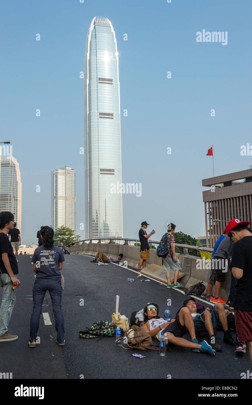 Protesters sleep it off on the hard roads of Admiralty. The iconic IFC ...
