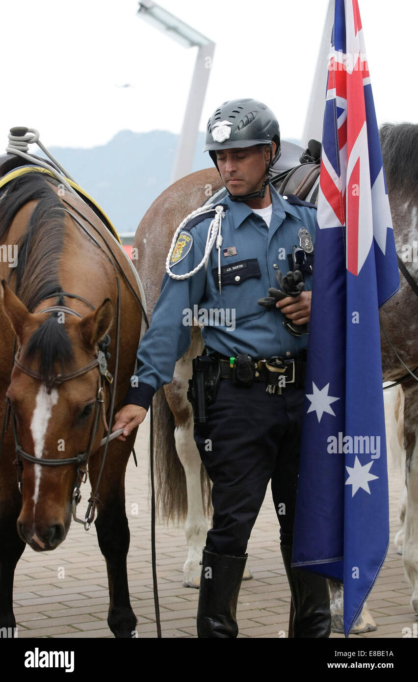 Vancouver, Canada. 3rd Oct, 2014. A Seattle mounted policeman carries a ...