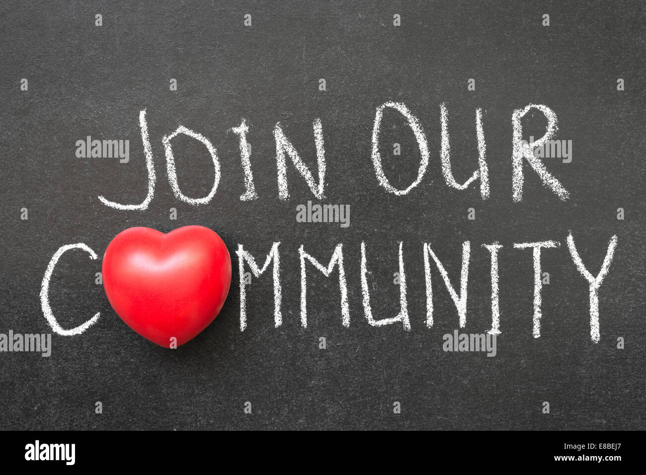 join our community phrase handwritten on blackboard with heart symbol ...