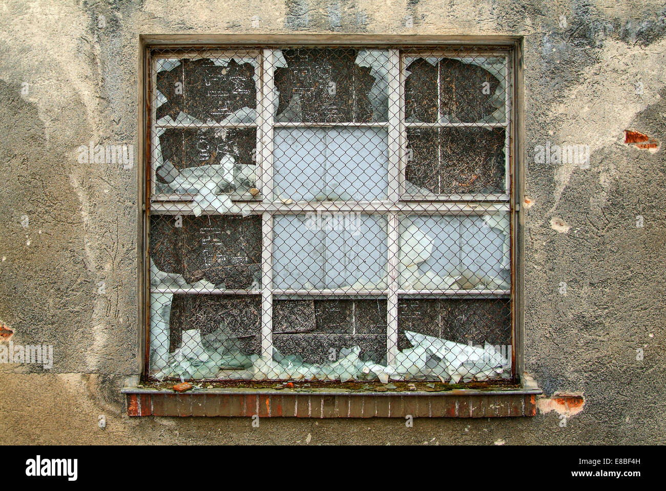 Broken window in an old industrial building Stock Photo - Alamy