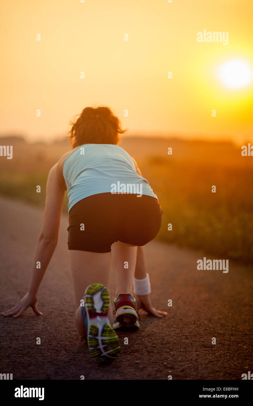 Sprinter start position on the track. Jogging sport Stock Photo - Alamy