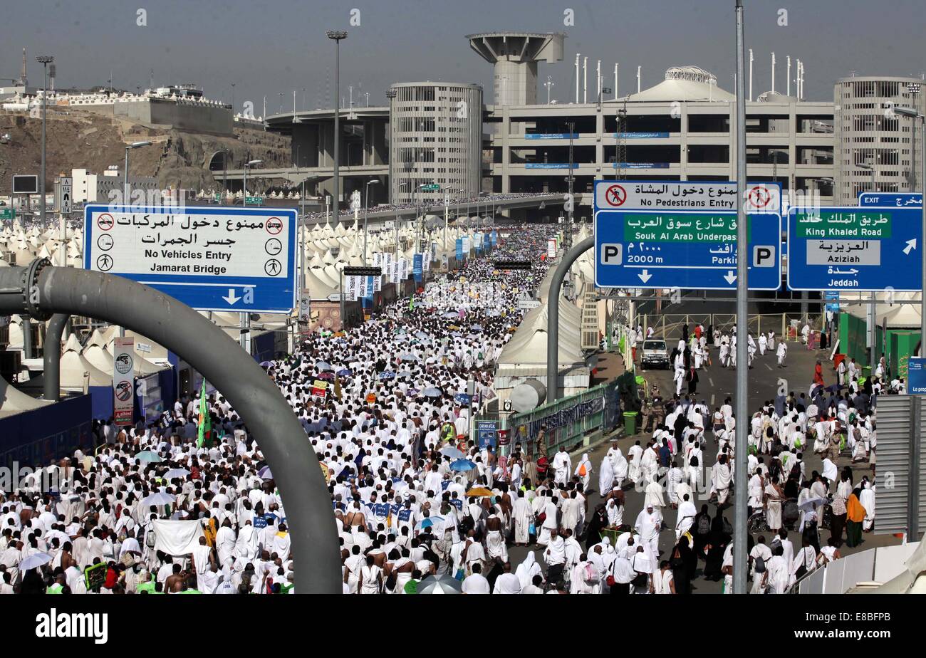 Mina, Mecca, Saudi Arabia. 4th Oct, 2014. Muslim pilgrims walk to cast ...