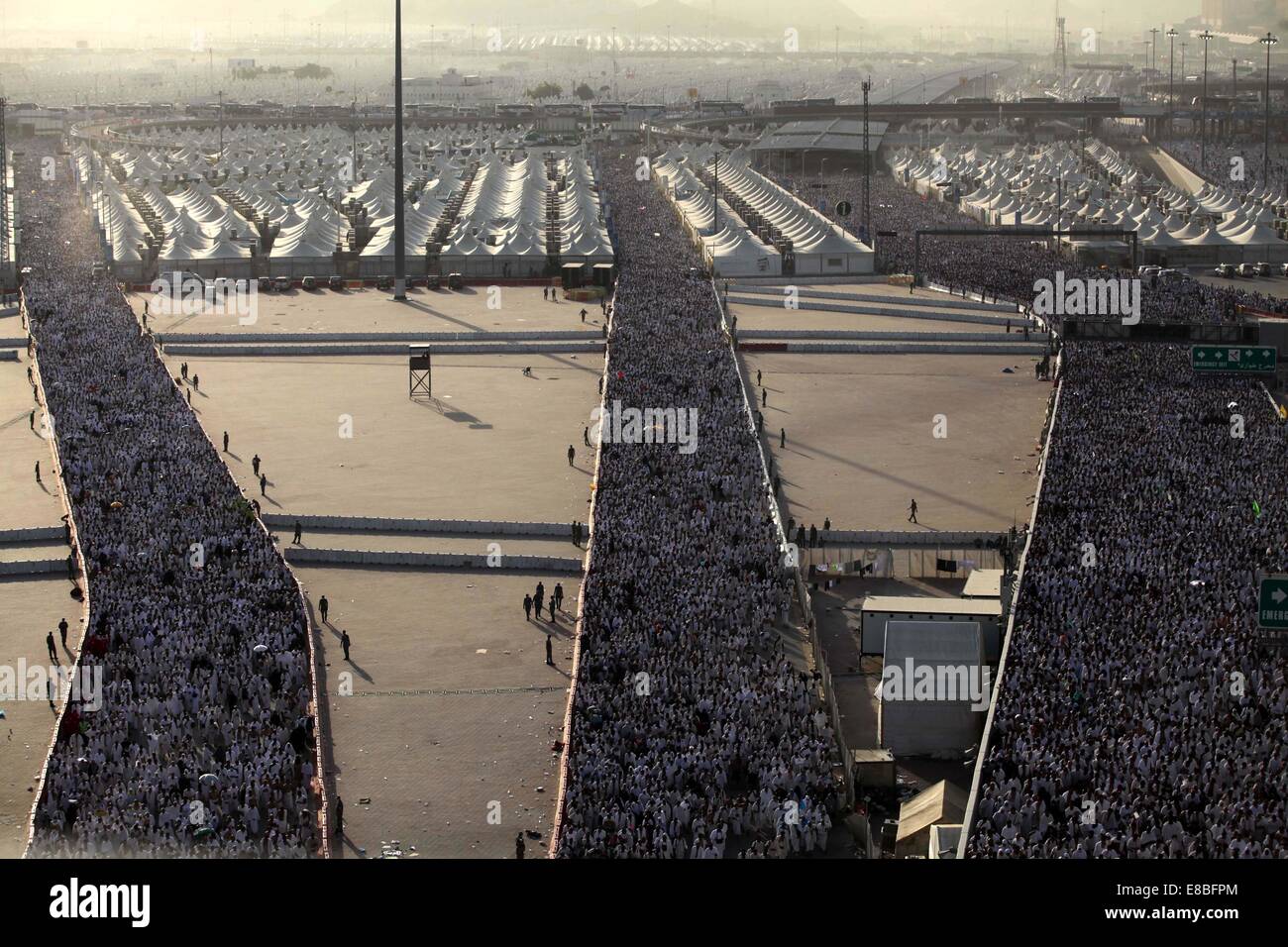 Mina, Mecca, Saudi Arabia. 4th Oct, 2014. Muslim pilgrims walk to cast ...