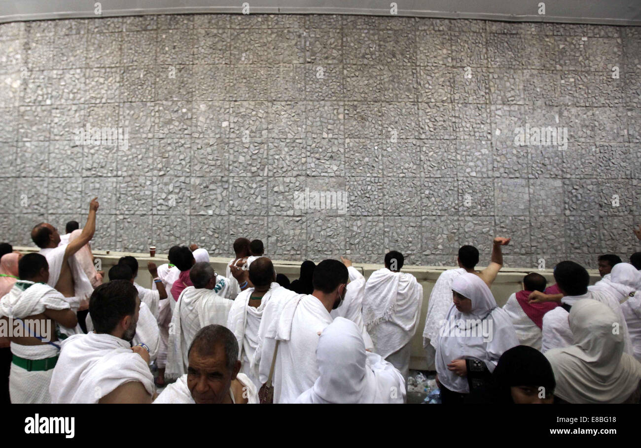 Mina, Mecca, Saudi Arabia. 4th Oct, 2014. Muslim pilgrims cast stones ...