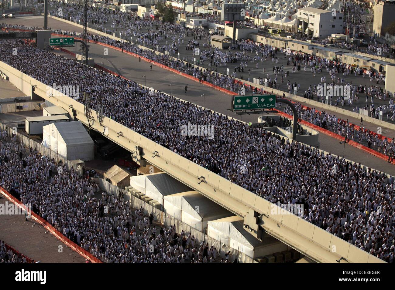 Mina, Mecca, Saudi Arabia. 4th Oct, 2014. Muslim pilgrims walk to cast ...