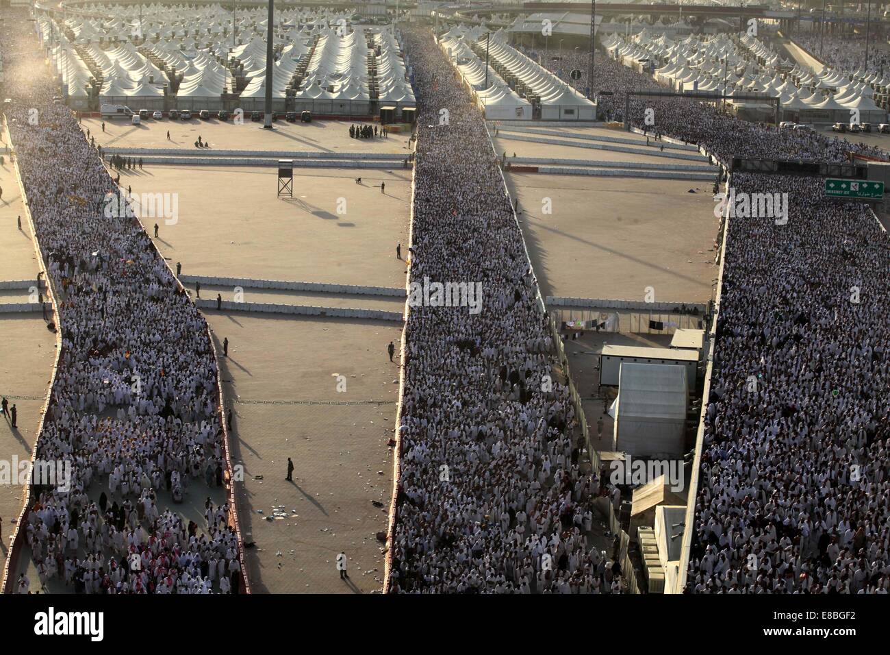 Mina, Mecca, Saudi Arabia. 4th Oct, 2014. Muslim pilgrims walk to cast ...