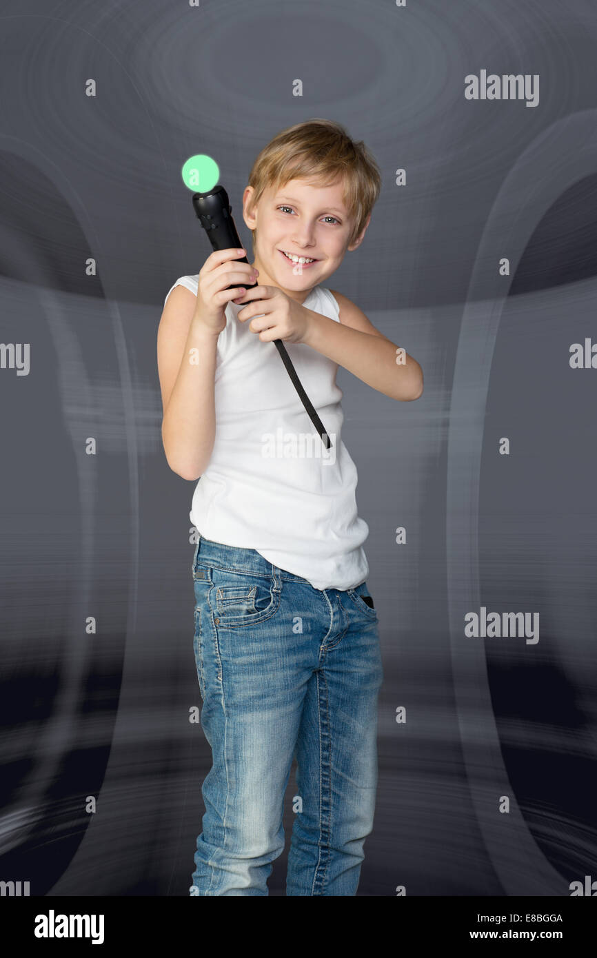 Boy playing a video game controller Stock Photo - Alamy