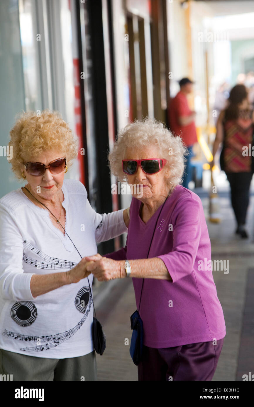 Elderly australian women in Sydney having fun dancing in the street and ...