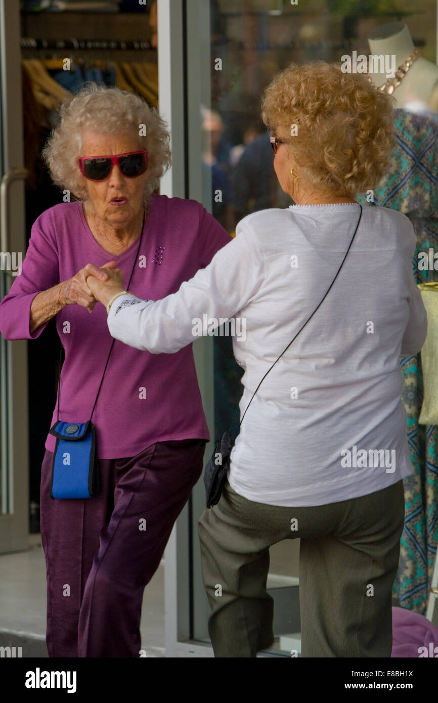 Elderly australian women in Sydney having fun dancing in the street and ...