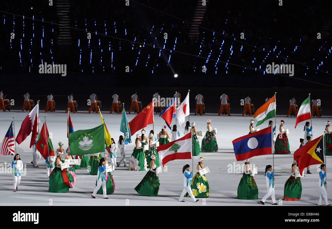 Incheon, South Korea. 4th Oct, 2014. Flags of nations and regions enter ...