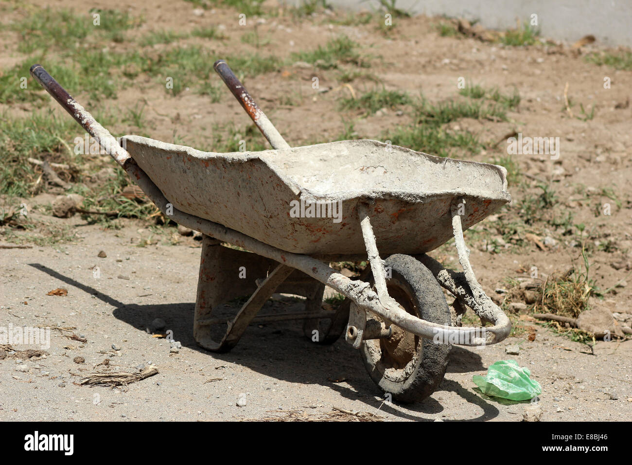 A wheelbarrow used for construction on a street in Cotacachi, Ecuador ...