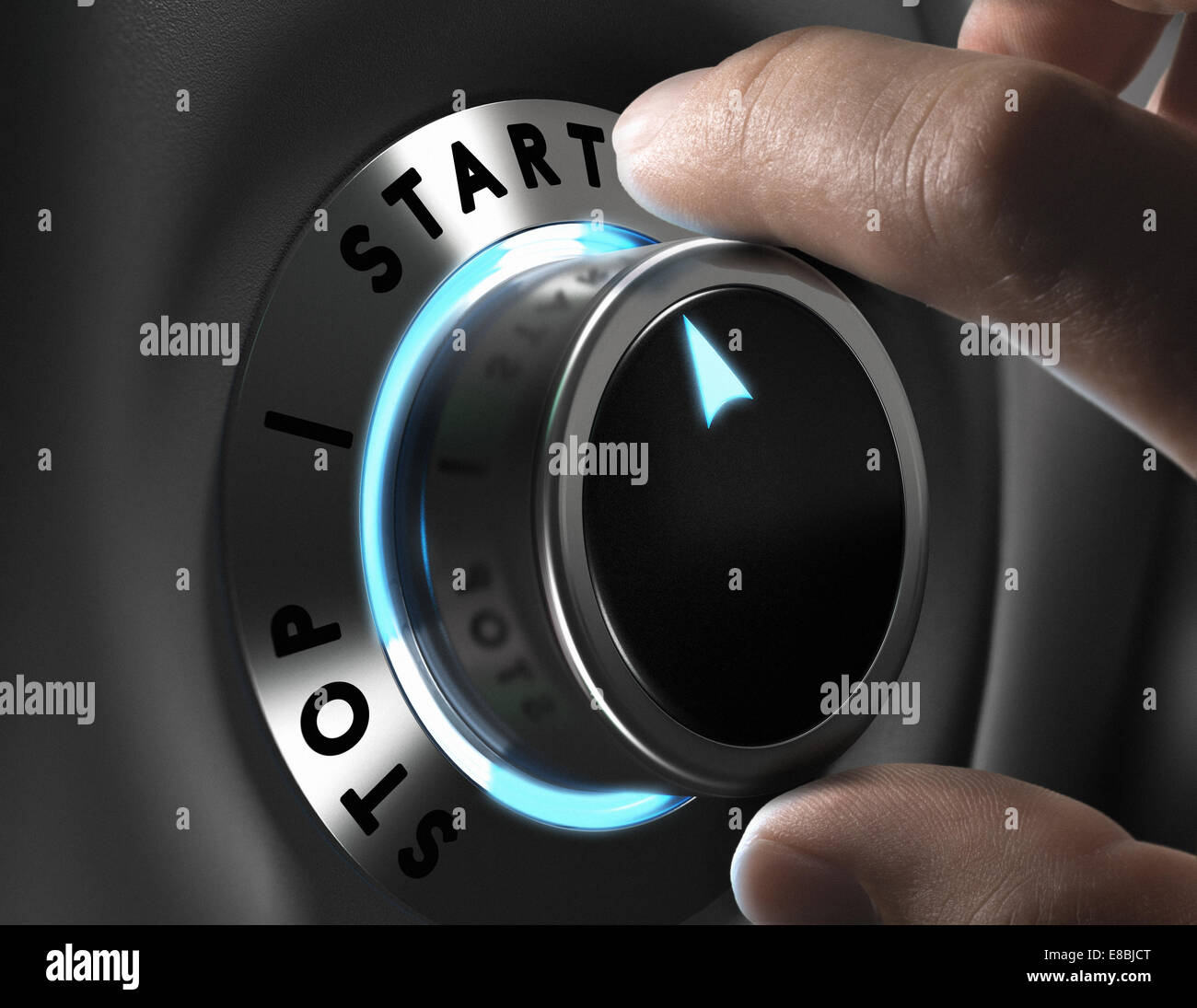 Man hand turning a start and stop button over grey background, Concept ...