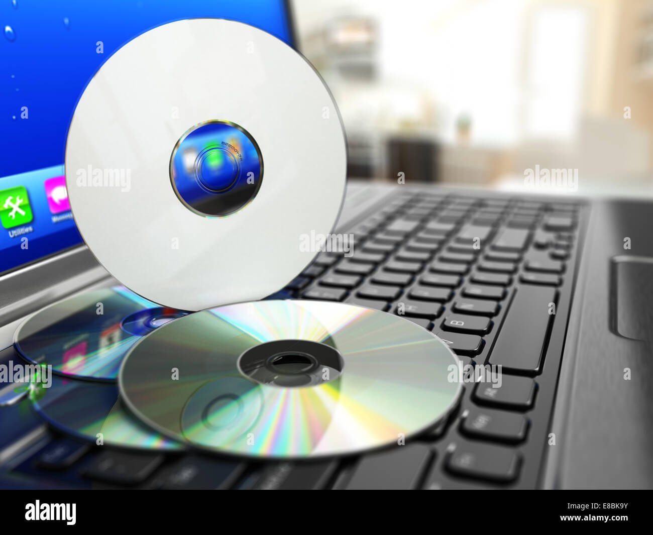 Software CD on laptop keyboard. Compact disks. 3d Stock Photo - Alamy