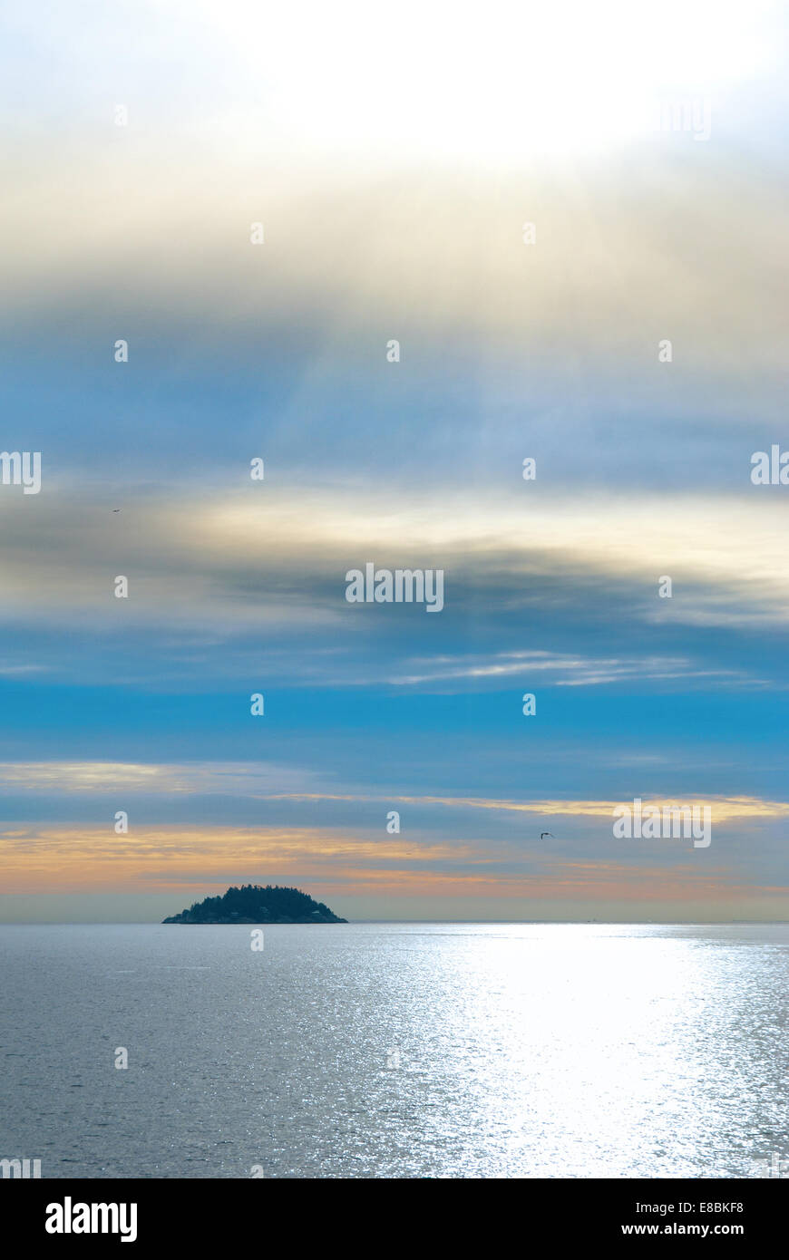 Small island in the sea. Sunset above the ocean Stock Photo - Alamy