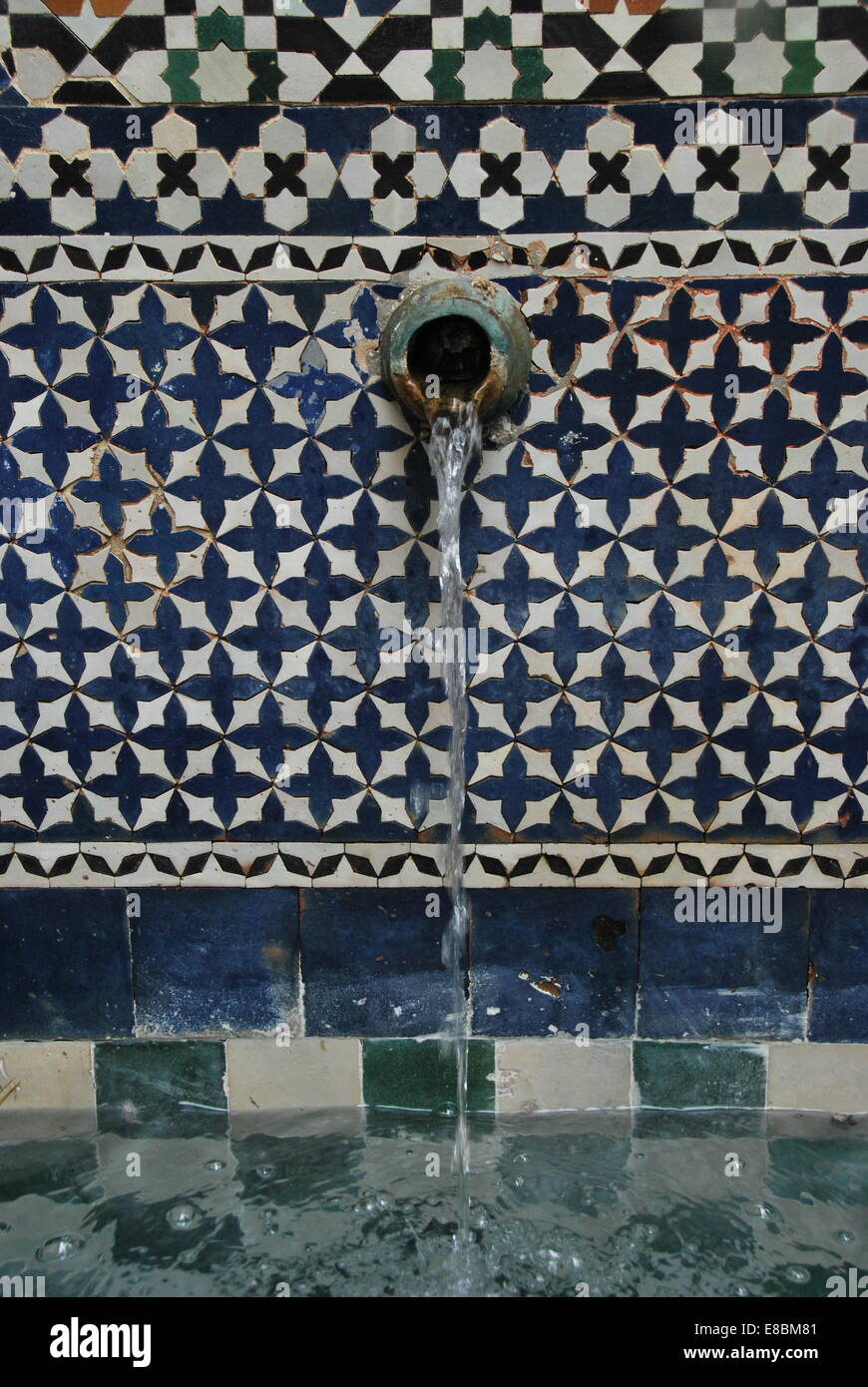 Morocco. Fez. Islamic tiled fountain. Falling water. Semi circular ...