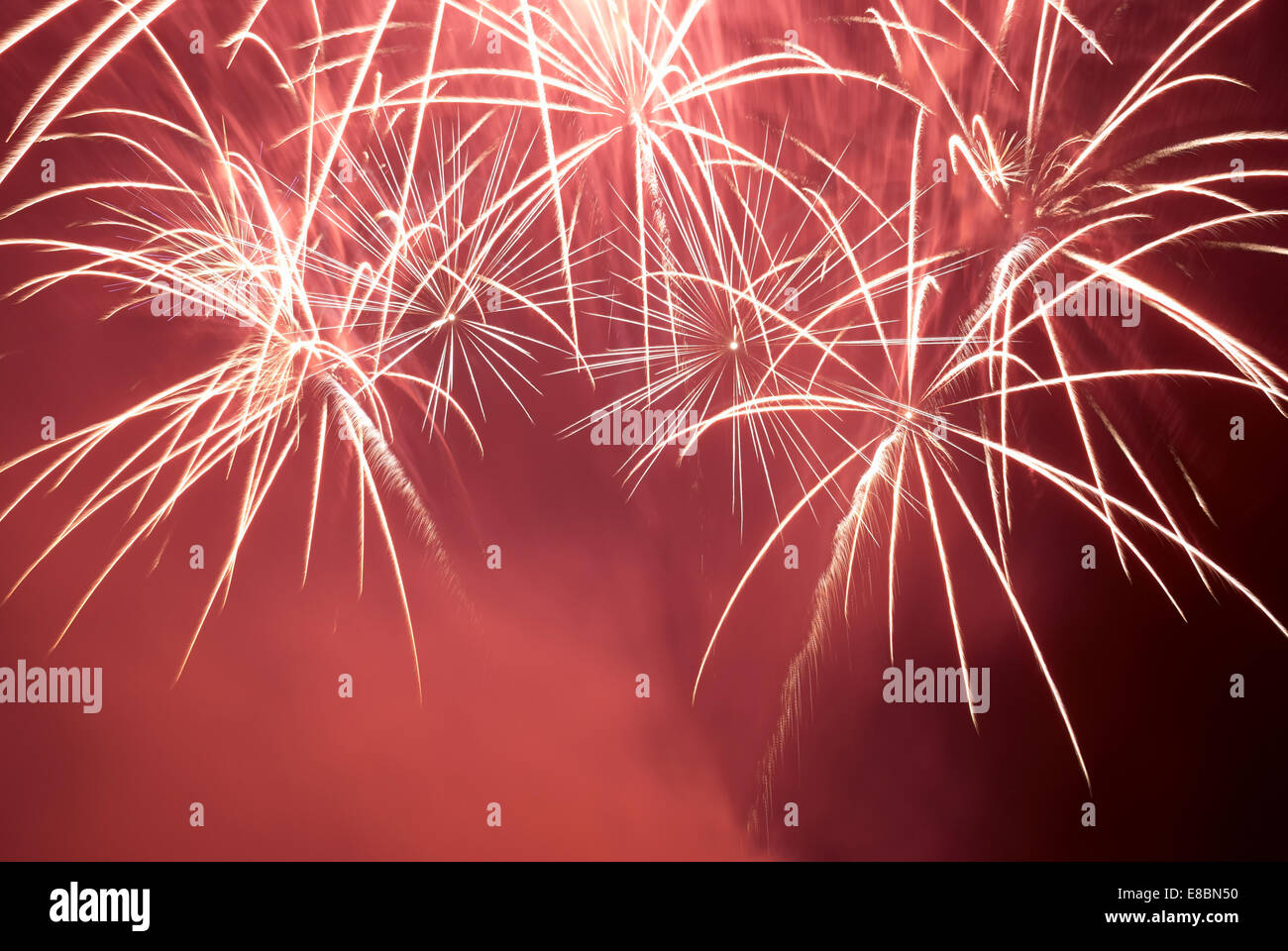 Red colorful fireworks on the black sky background. Holiday celebration ...