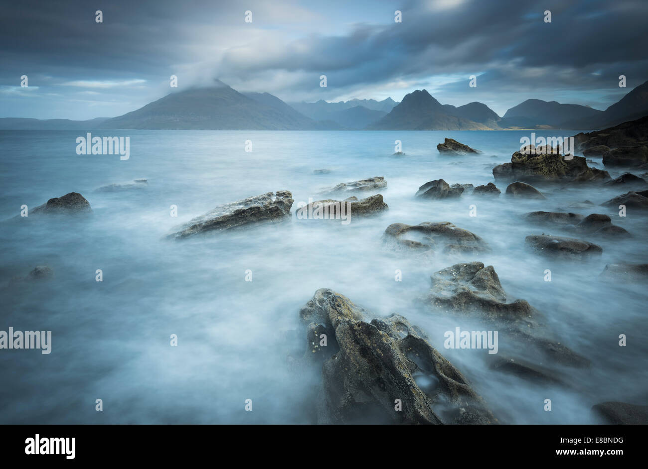 INcoming tide and stormy skies over Loch Scavaig and the Black Cuillin ...