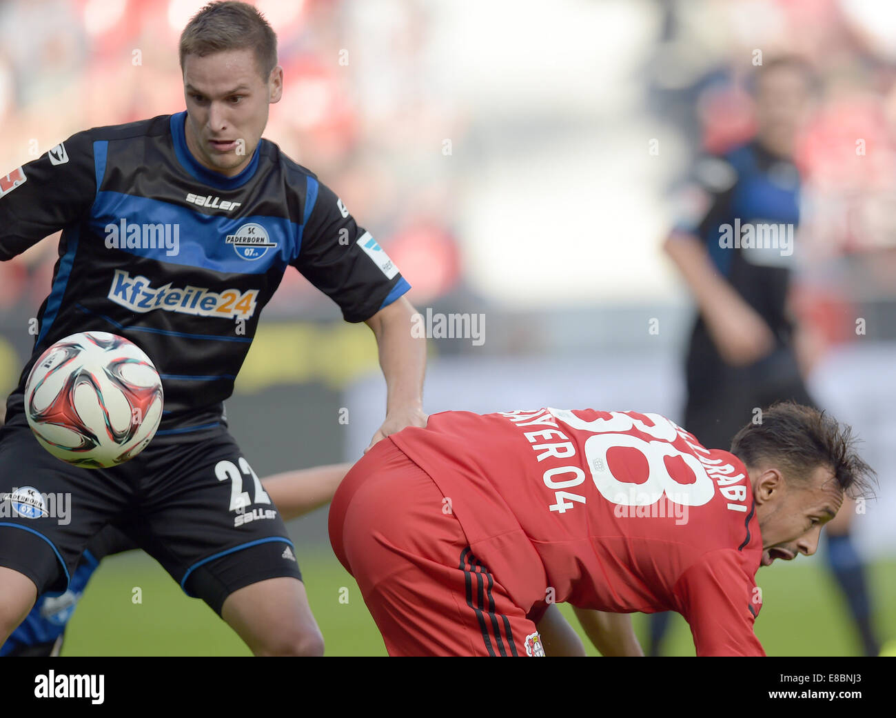 Leverkusen, Germany. 04th Oct, 2014. Leverkusen's Karim Bellarabi (R ...