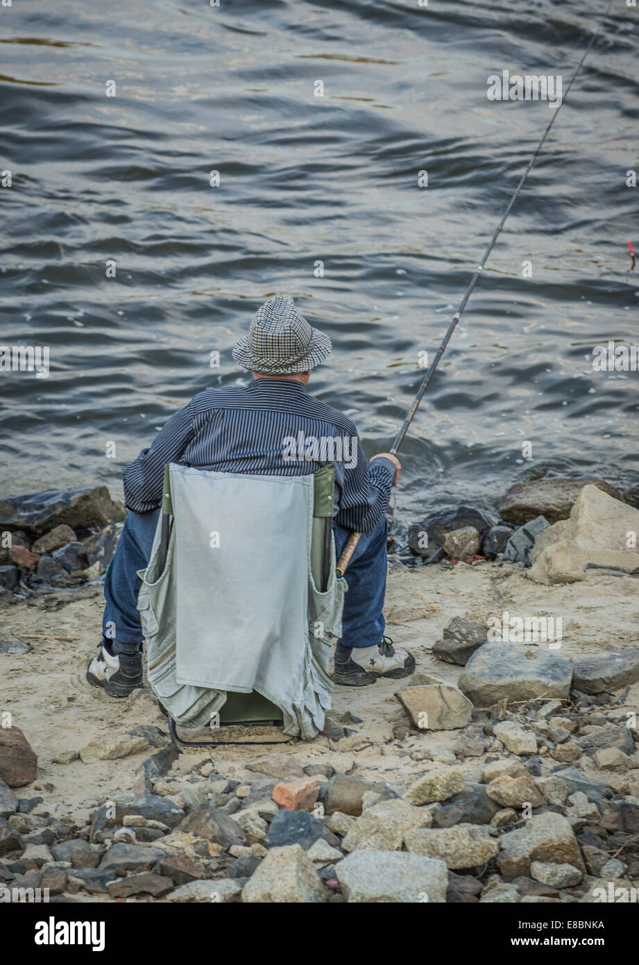 Old man with fishing rod hi-res stock photography and images - Alamy