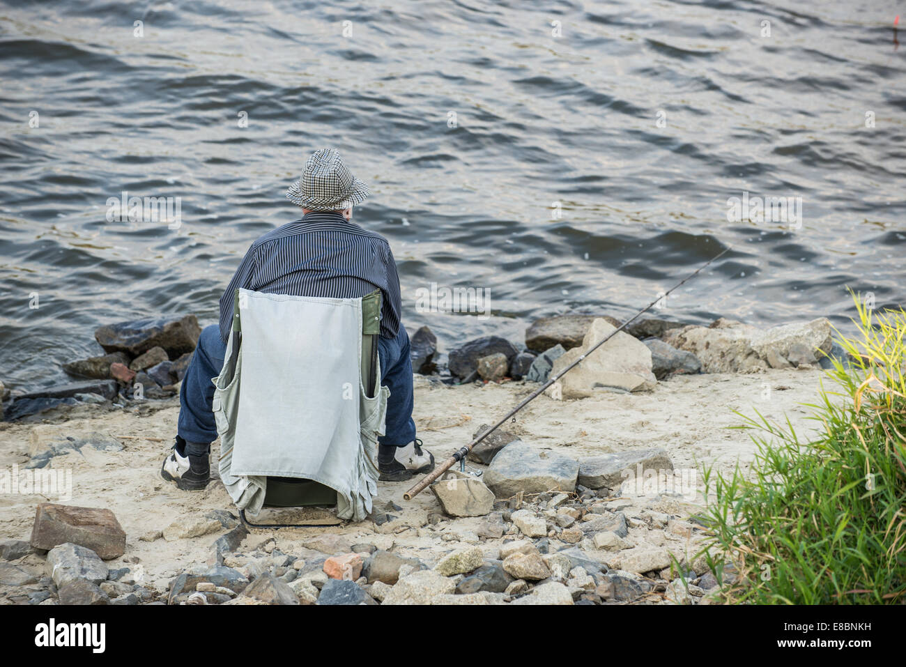 Old man with fishing rod hi-res stock photography and images - Alamy