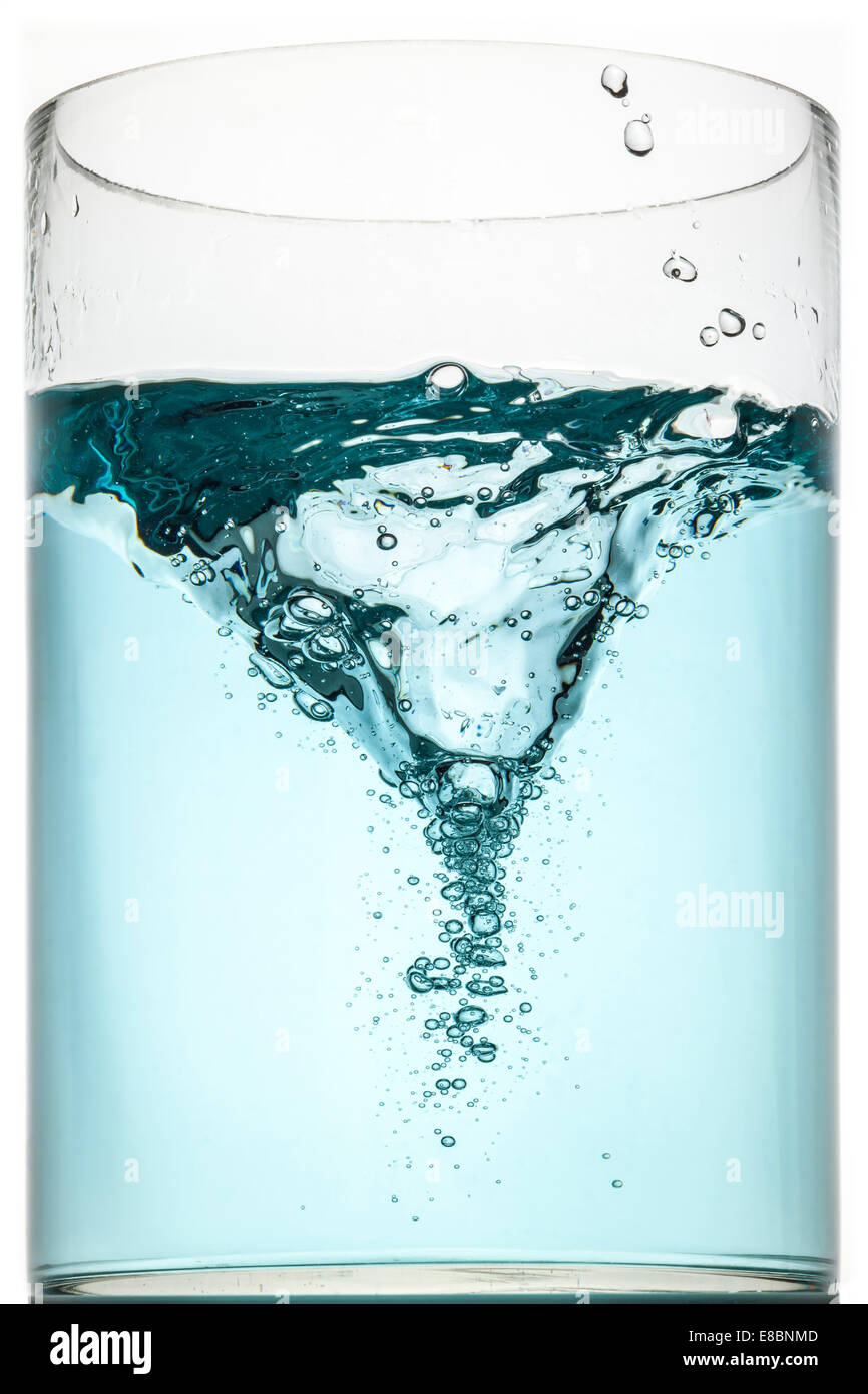 Water splash in a cup isolated on white. Pure wave with bubbles Stock ...