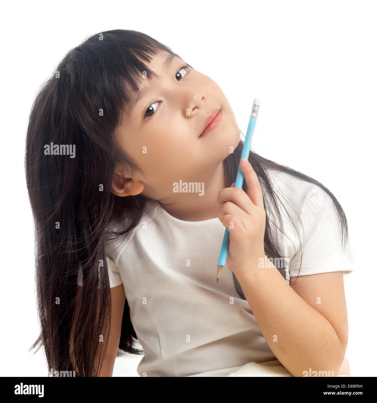 Asian child holding pencil on white background Stock Photo - Alamy