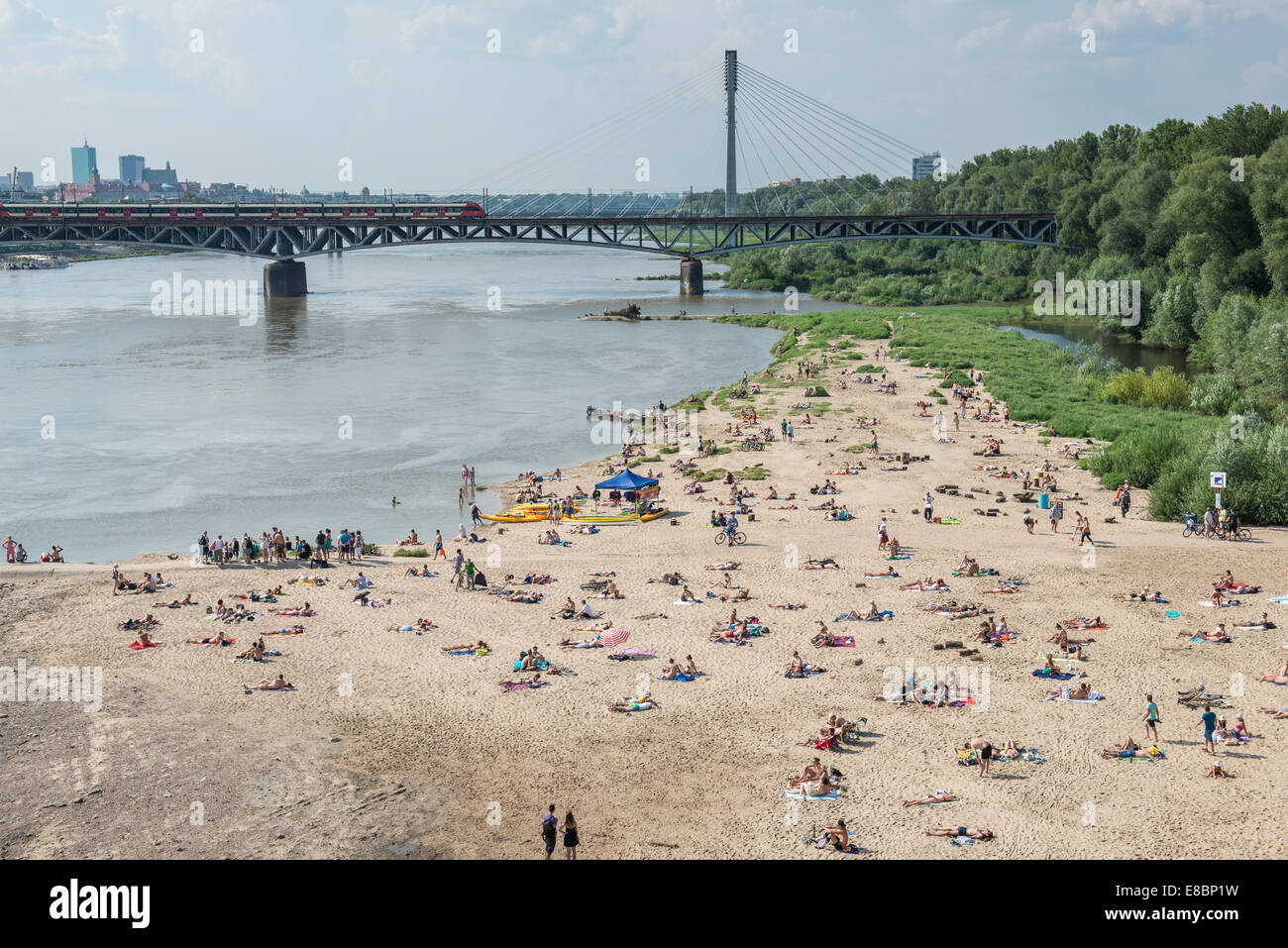 Public beach with Railway bridge on background over Vistula River in ...