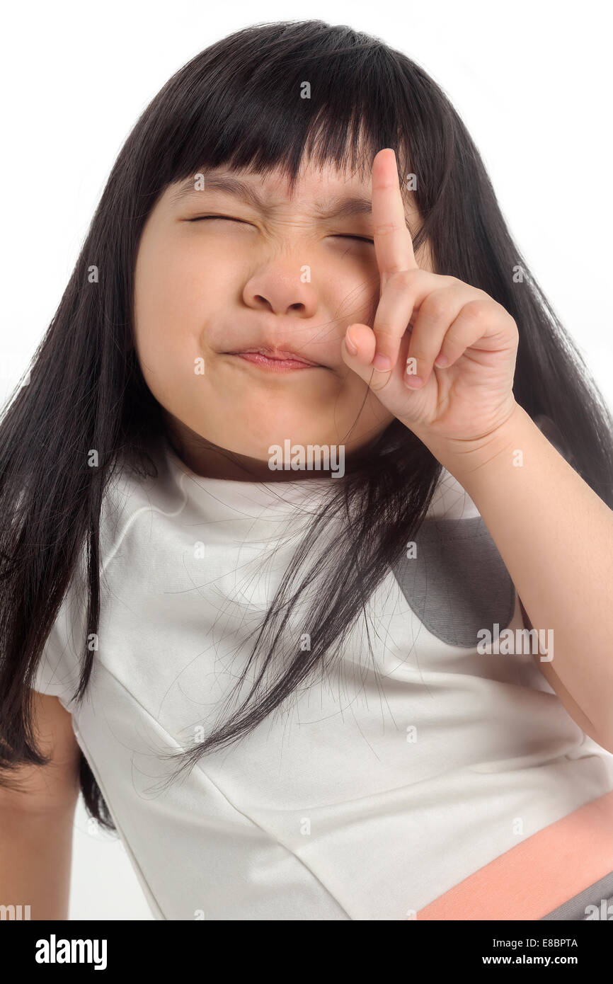 Child pointing up with one finger and funny face Stock Photo - Alamy