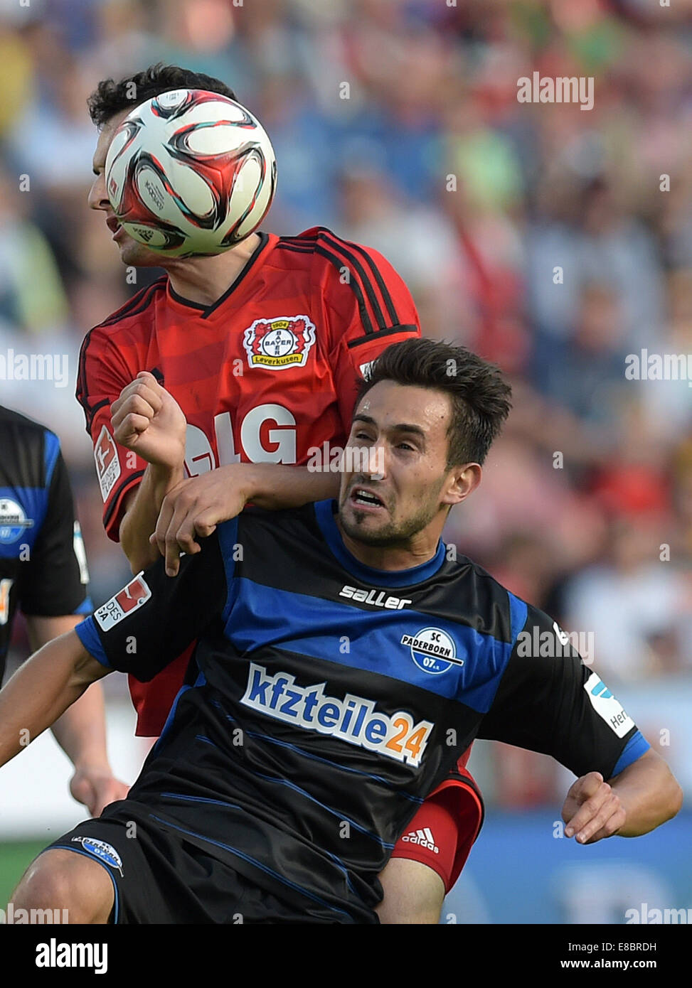 Leverkusen's Levin Oztunali (L) and Paderborn's Lukas Rupp in action ...