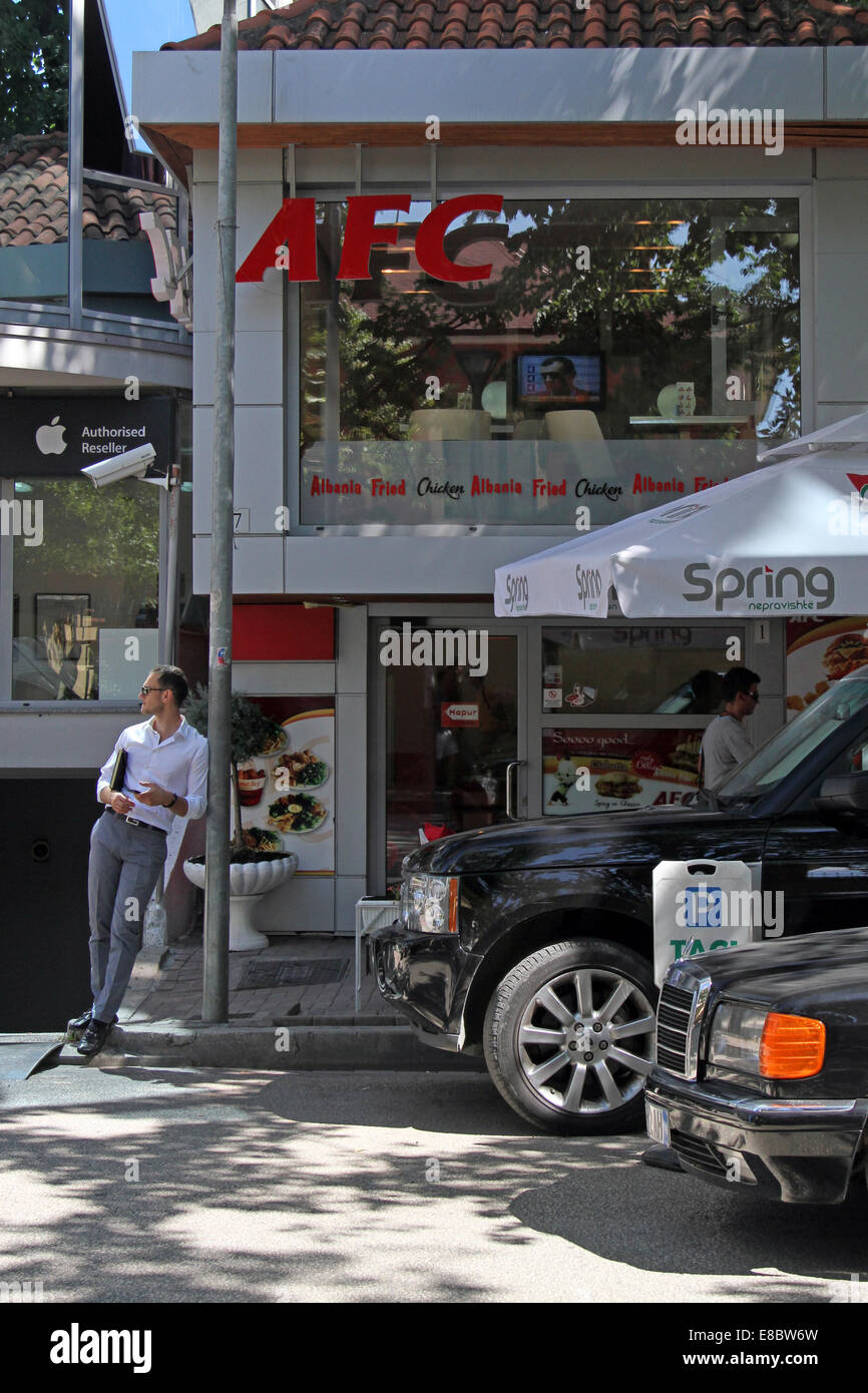 Man outside an Albania Fried Chicken outlet in Tirana, Albania Stock ...