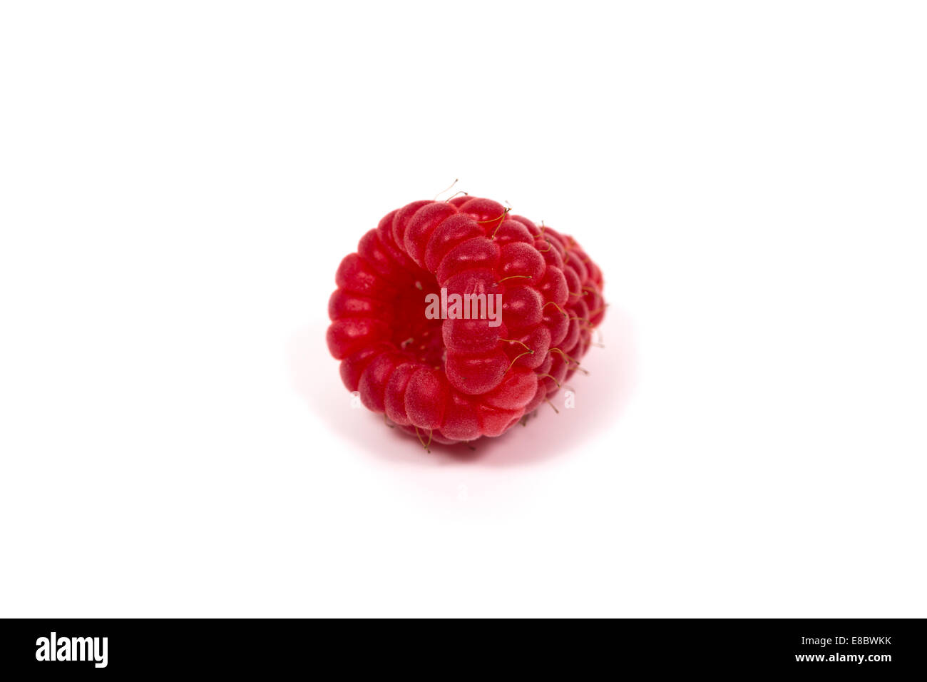 ripe red raspberry isolated on white background Stock Photo - Alamy