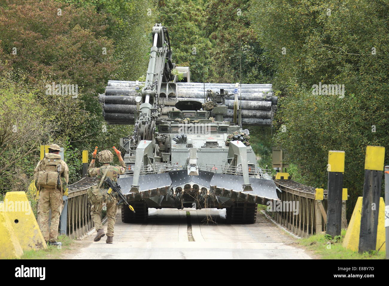 Trojan armoured vehicle armoured engineer vehicle being guided over a ...