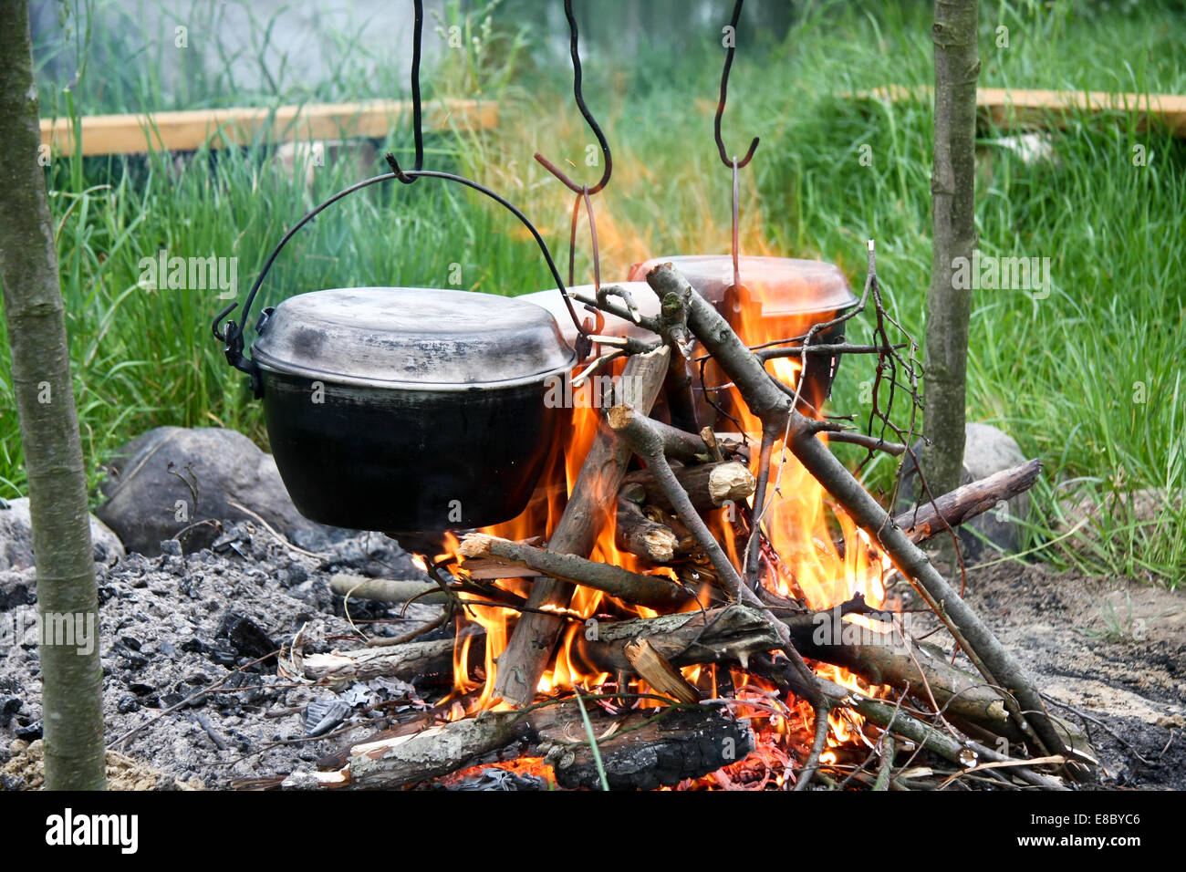 Cooking the meal in a kettle on the camp fire:River rafting expedition ...