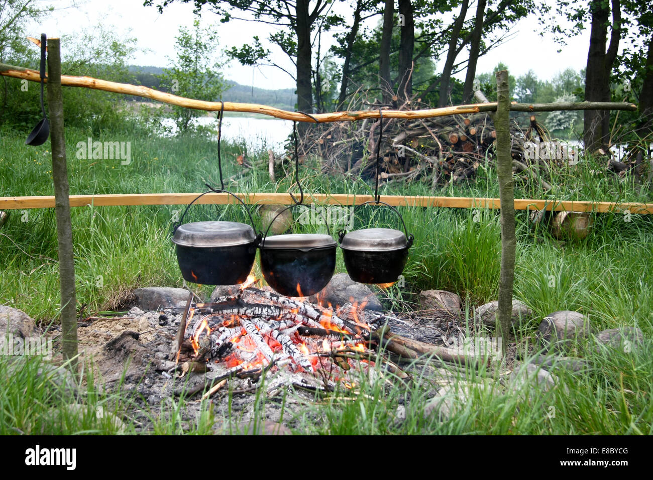 Cooking the meal in a kettle on the camp fire:River rafting expedition ...