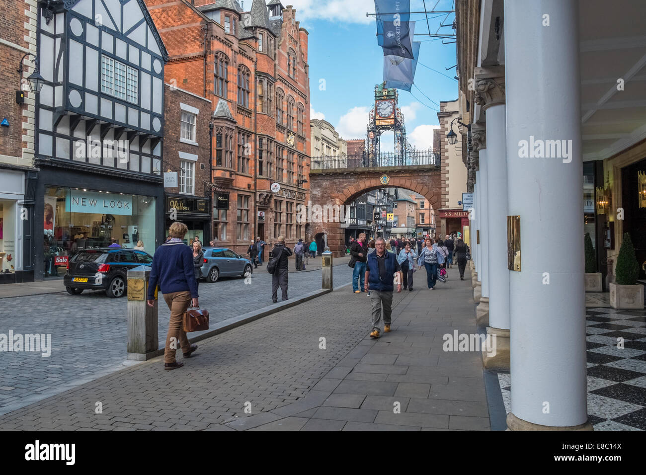 Foregate Street shopping area featuring arched wall and clock, Chester ...