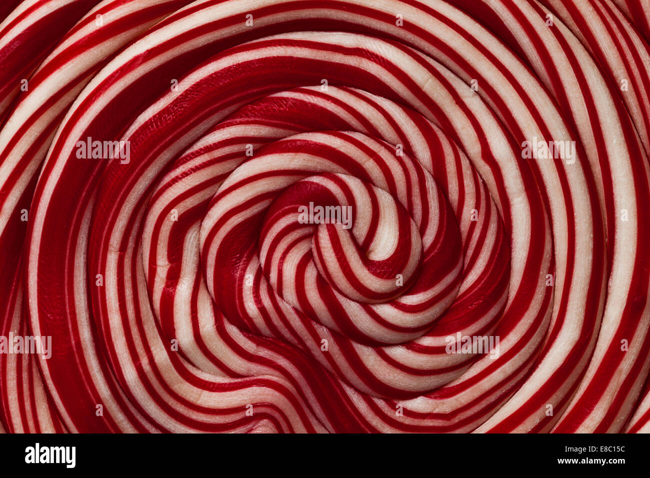 Red Swirly lollipop background Stock Photo - Alamy