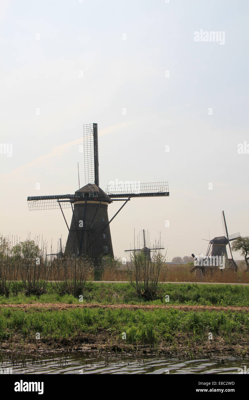 Windmills on the canal bank. Typical Dutch rural landscape in the ...