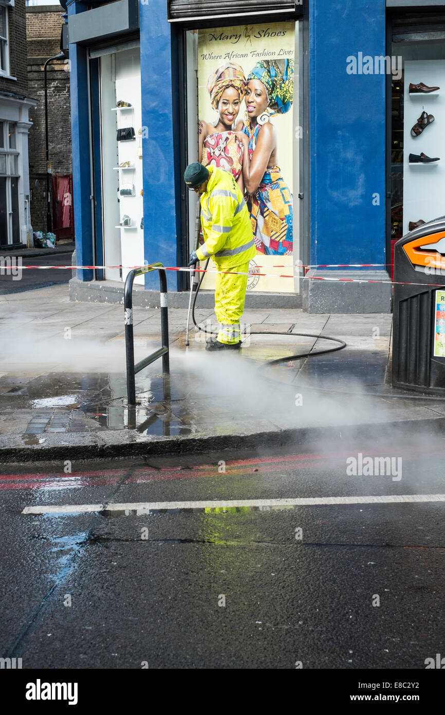 Cleaning pavements, Shoreditch High Street, London, United Kingdom ...