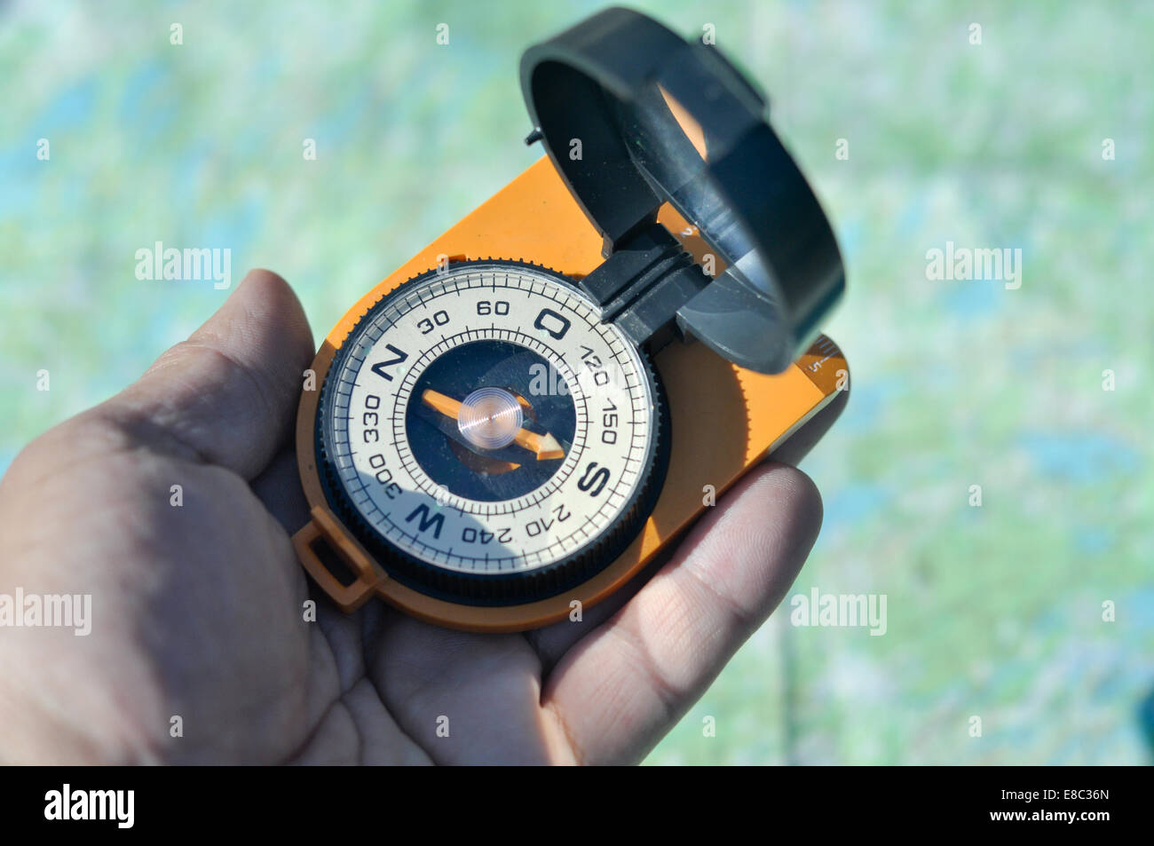 Compass in hand. Open the magnetic compass holds the left hand men ...