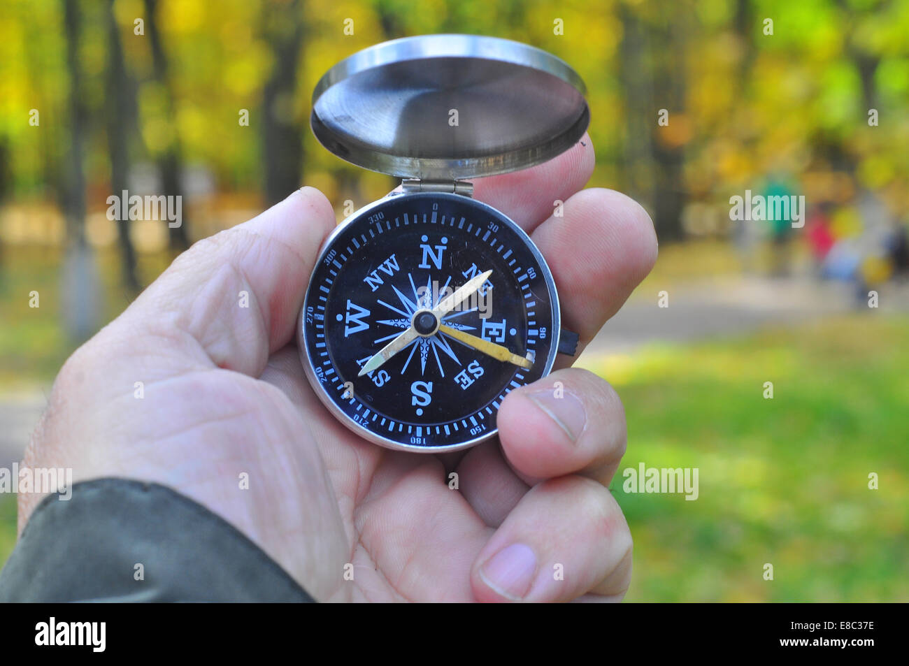 Compass in hand. The navigation device in the man's hand on the ...