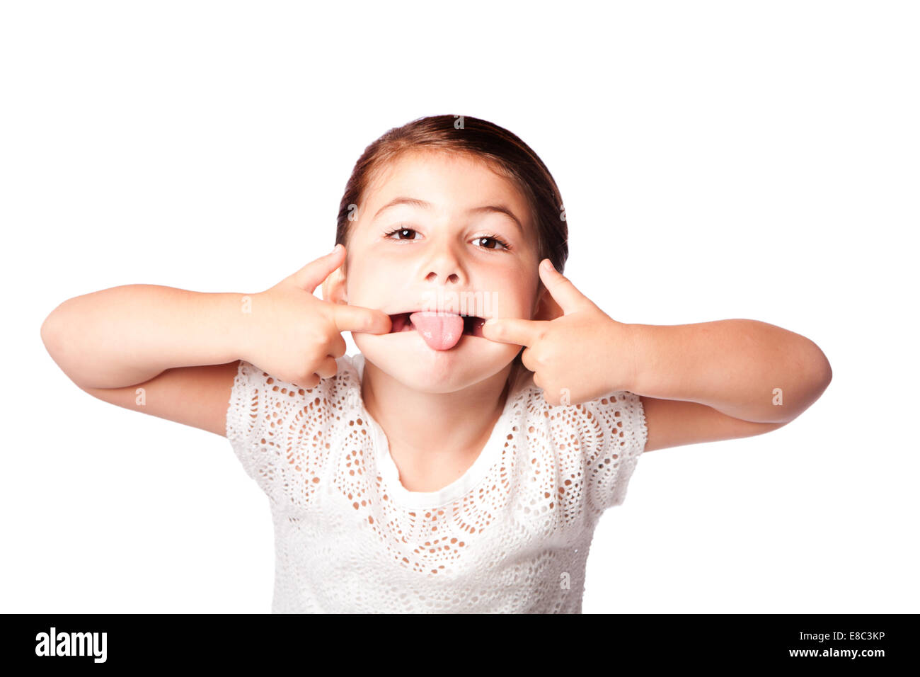 Cute girl making silly funny face, isolated Stock Photo - Alamy