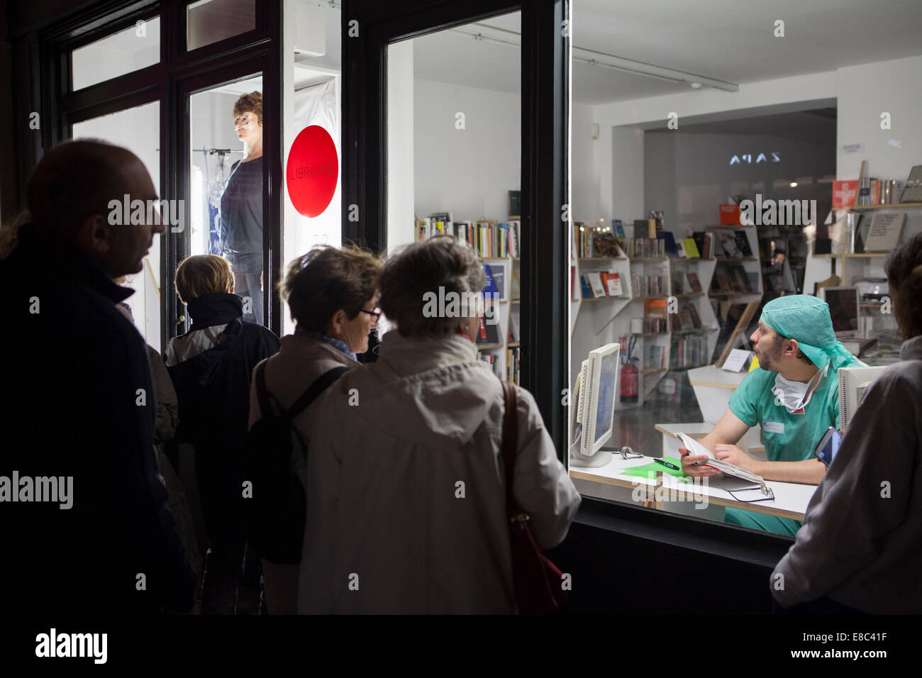 Paris, France. 4th Oct, 2014. People observe the live performance art ...