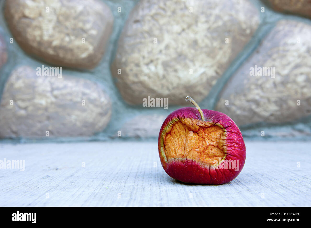 Partly eaten rotten fruit Stock Photo - Alamy