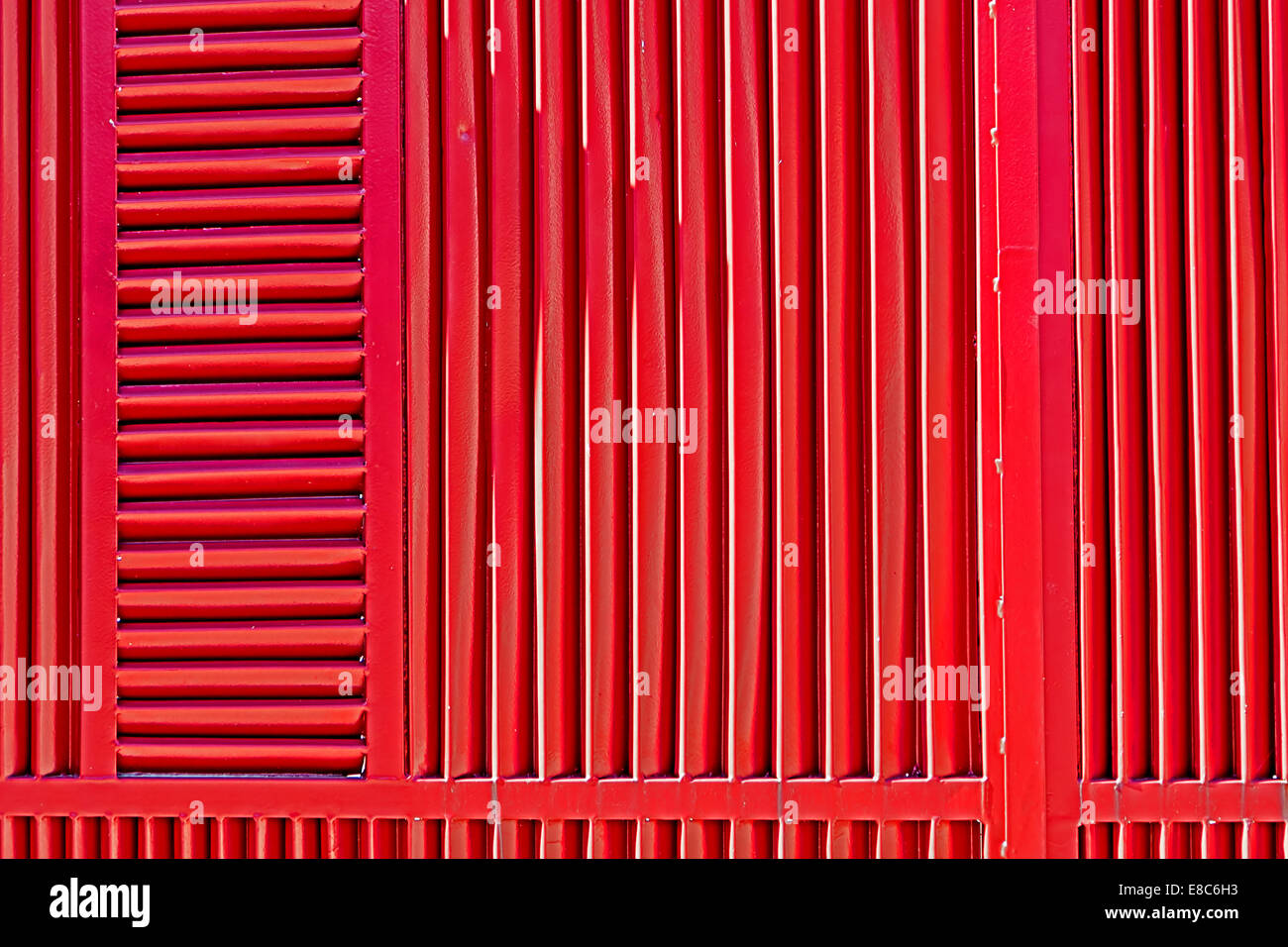 Decorative fence of metal bars, painted red Stock Photo - Alamy