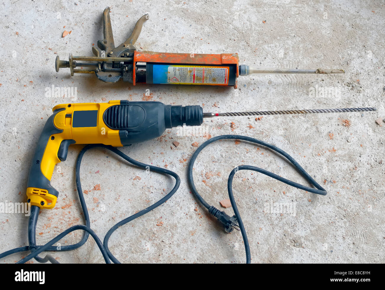 Construction Site: power drill with pistol cartridge resin Stock Photo ...