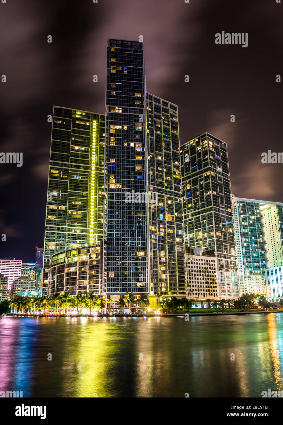 Skyscrapers along the Miami River at night, in downtown Miami, Florida ...
